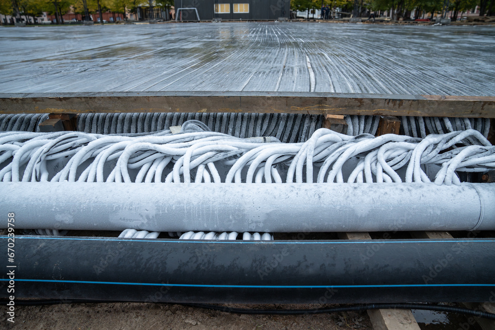 Artificial ice rink portable piping system. Preparing icy surface for ...
