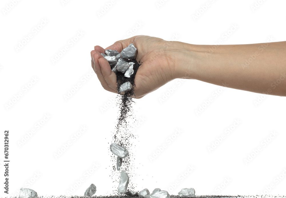 Silver ore nugget fall from industrial Miner hand fingers. Many pieces ...