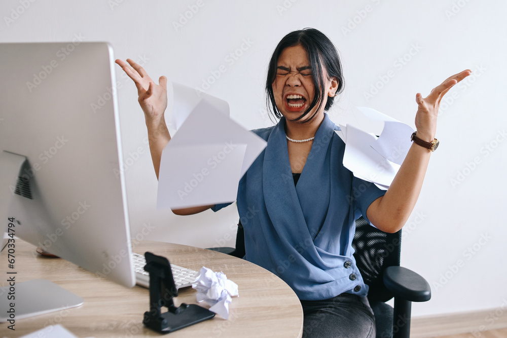 Asian businesswoman or female office worker screaming, shouting and ...