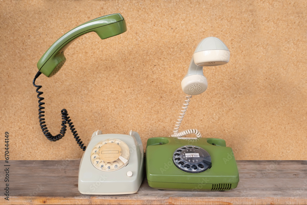 Two classic phones with levitating handsets with Disc Dial, phone ...
