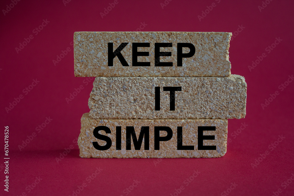 Keep it simple symbol. Concept word Keep it simple on beautiful brick ...