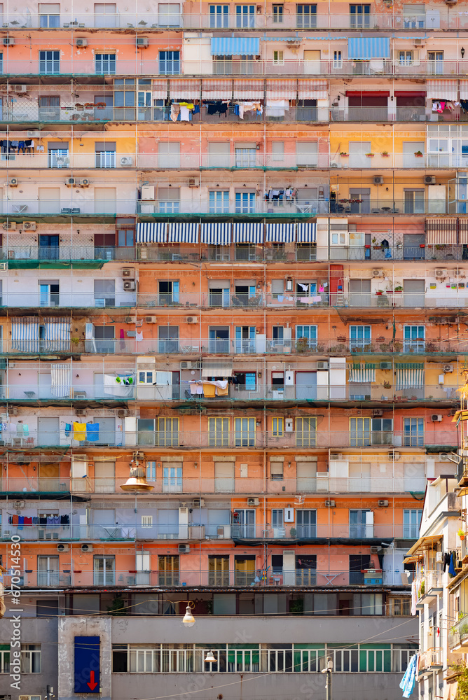 Colorful facade of a big block of flats in the old town “Centro storico ...