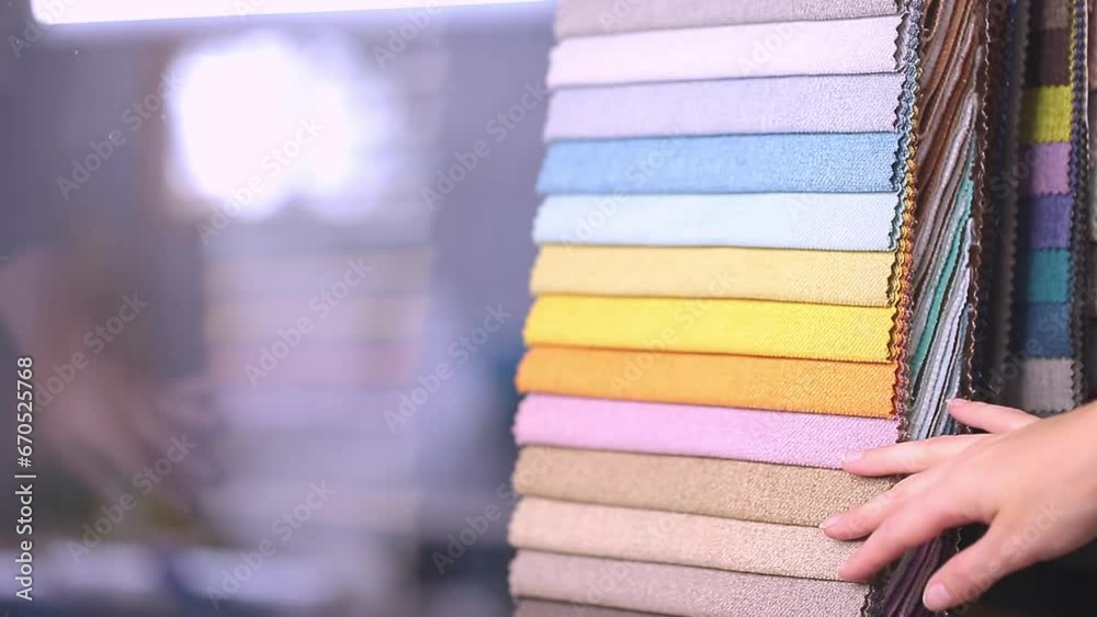 Fabric swatches in different colors are stacked for selection. The ...