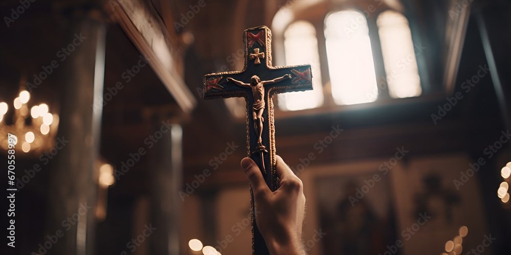 Hand holding a cross in church during prayers, Mass in the Catholic ...