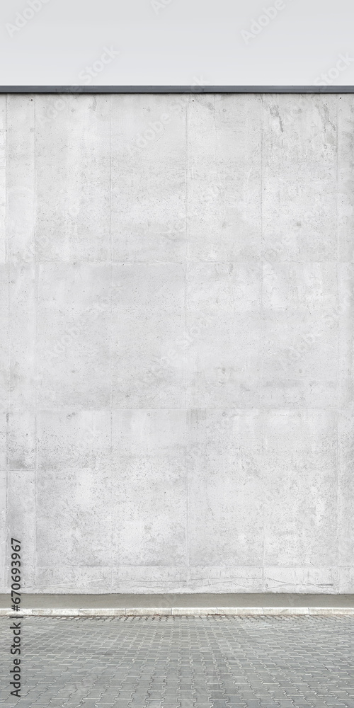 a fragment of a street city concrete wall of a building and an paving ...