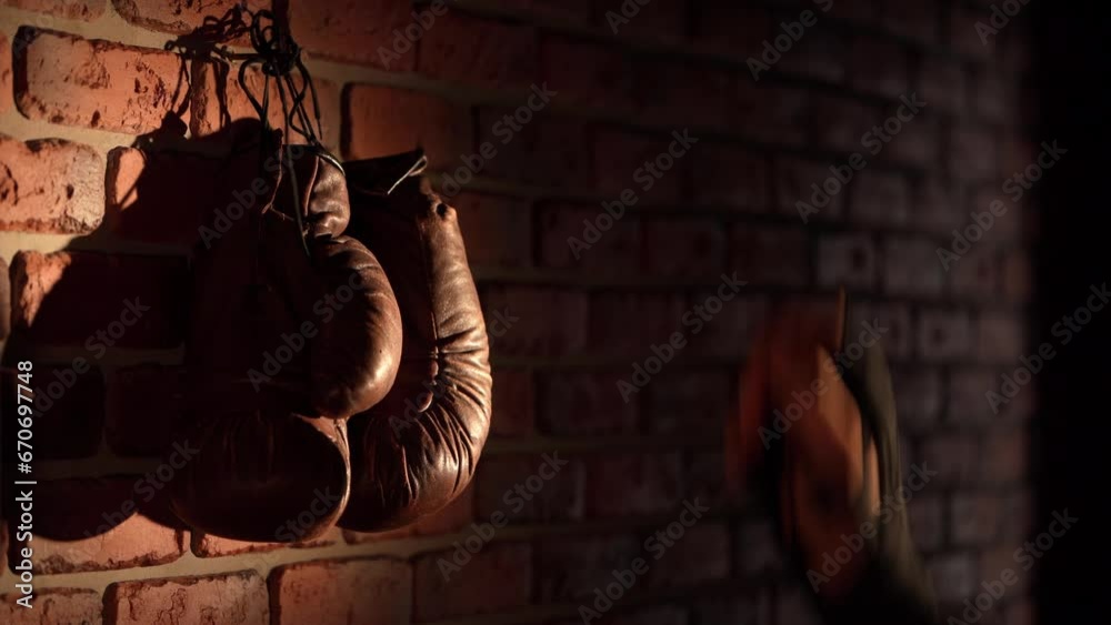 The shot shows a close up of a loft style brick wall with a nail nailed ...