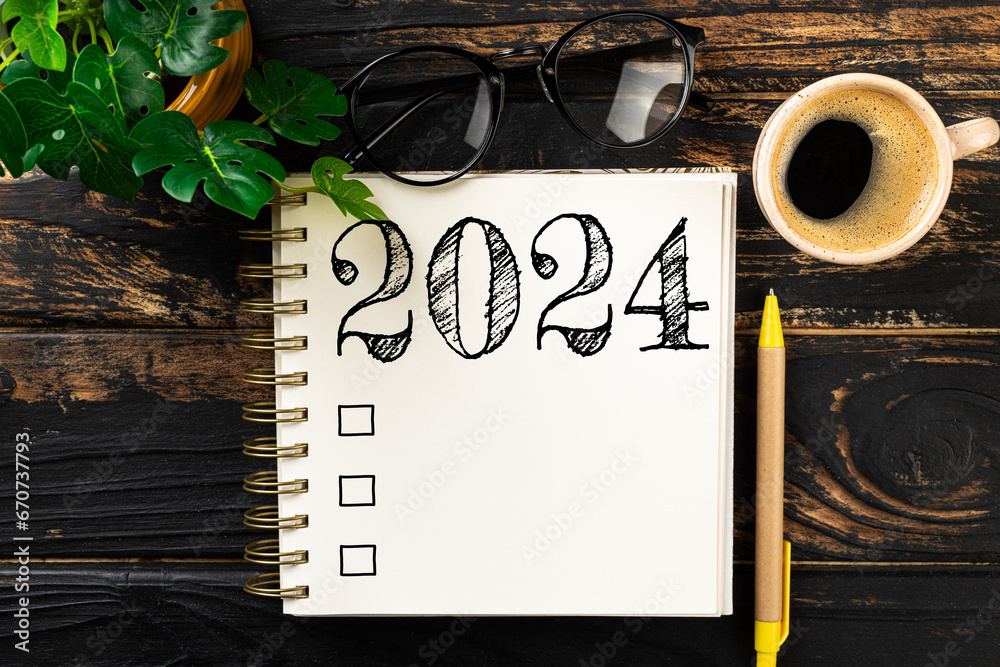 New year resolutions 2024 on desk. 2024 resolutions list with notebook ...