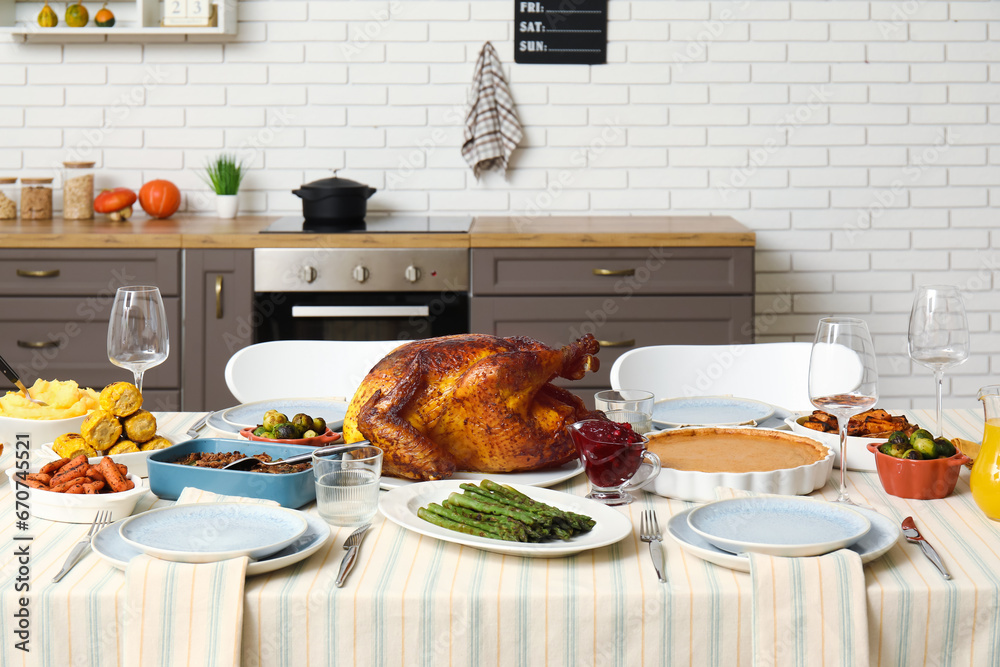 Festive dining table with tasty food for Thanksgiving Day in kitchen ...