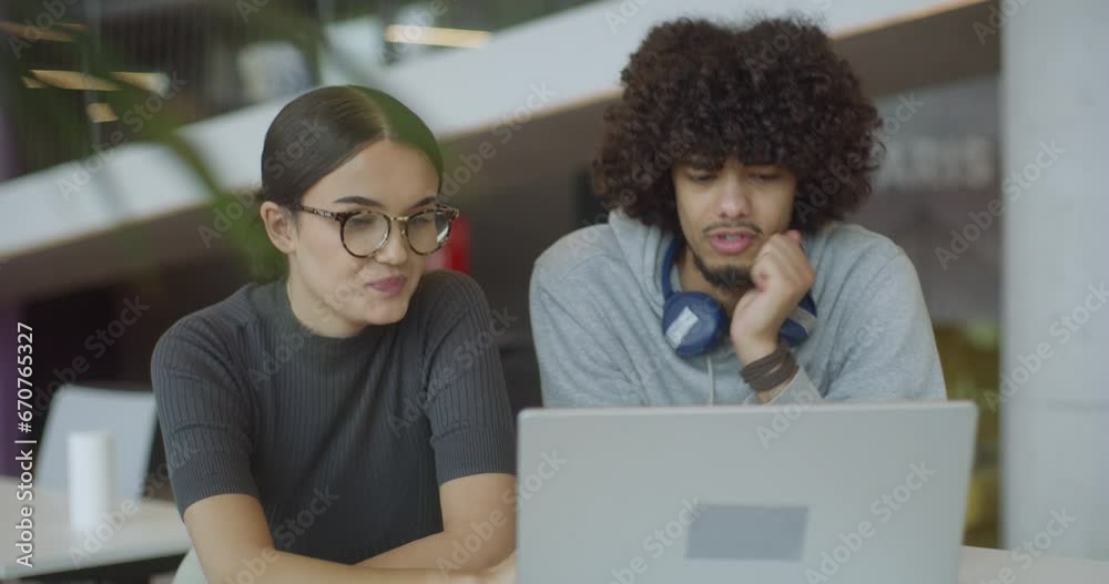 African American man and his colleague work harmoniously in an office ...