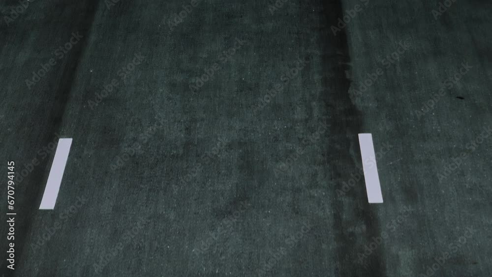 A close-up reveals the finely textured asphalt surface, engineered for ...