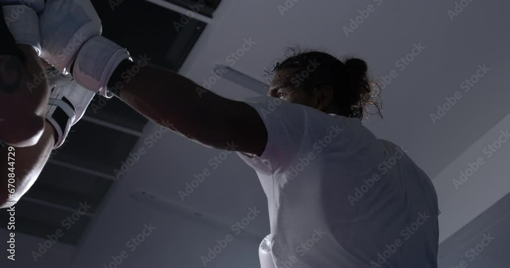 Fighter punching opponent in slow-motion at 800 fps, low-angle of ...