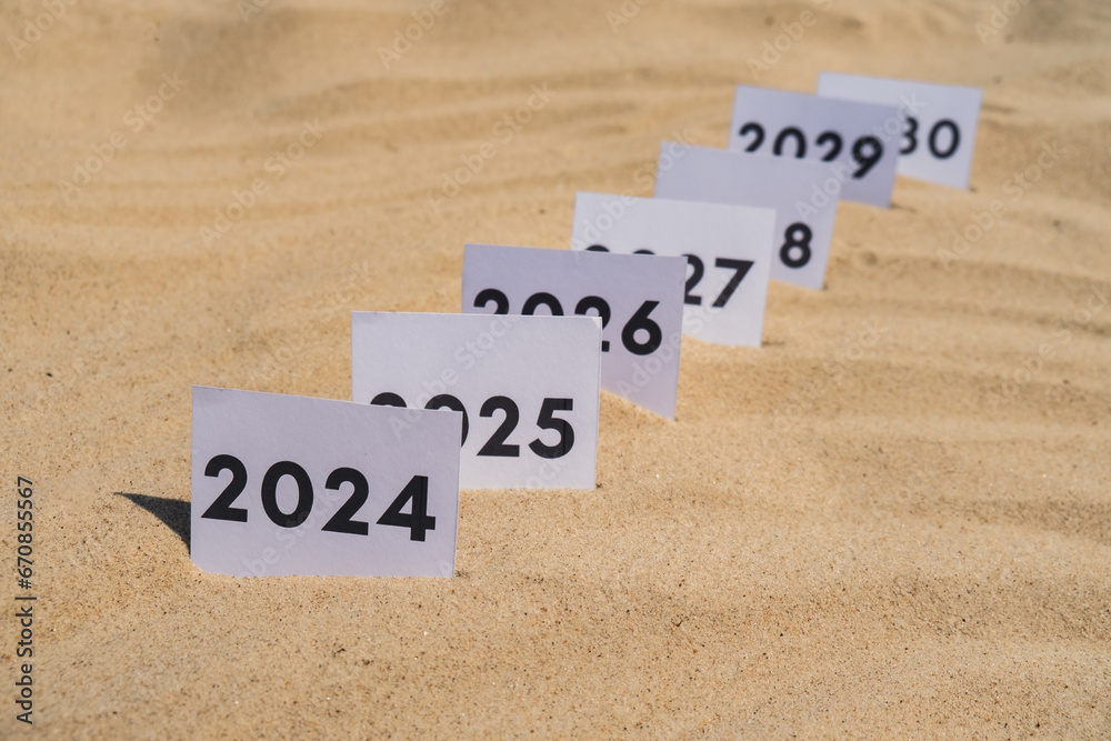 Paper cards with numbers of years from 2024 to 2030 in a row. New year ...
