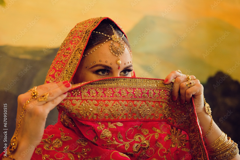 Young hindu woman model with traditional jewelry. Indian costume red ...