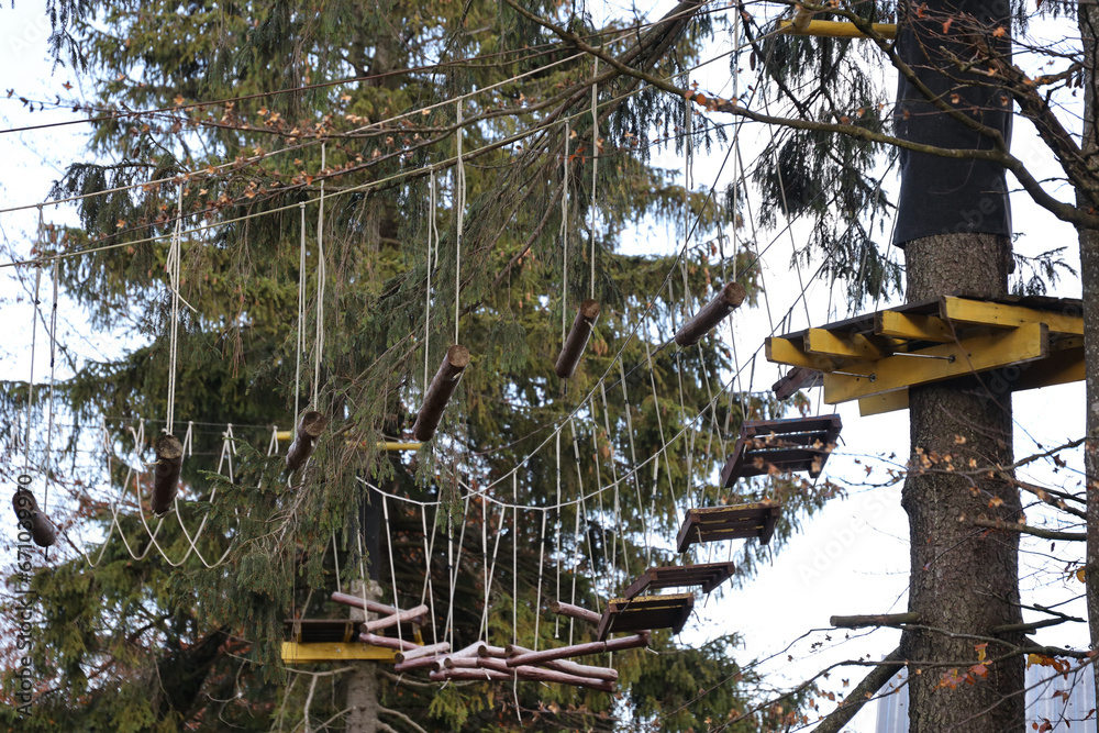 Rope bridge in adventure treetop park for tree climbing and sport ...