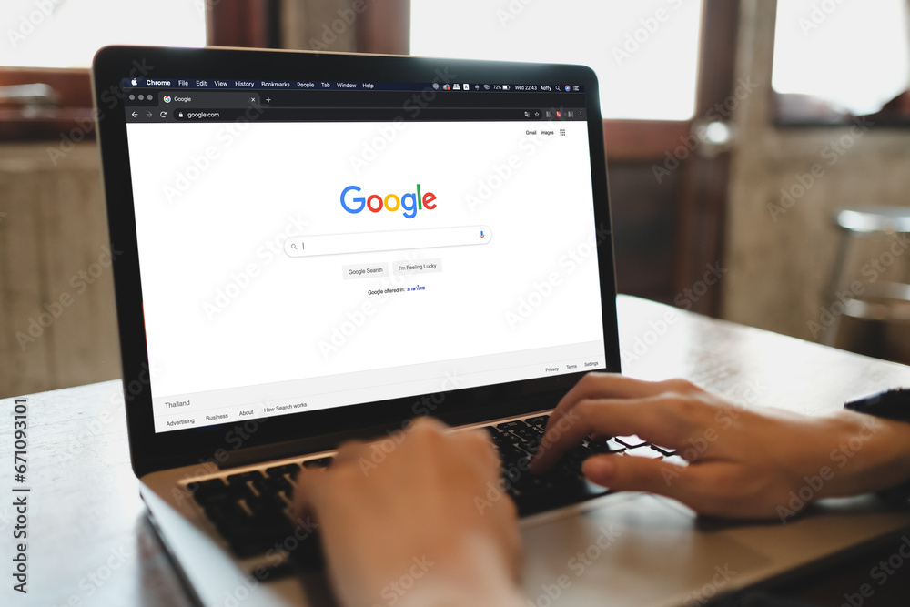 Bangkok. Thailand. November 3,2023: A woman is typing on Google search ...