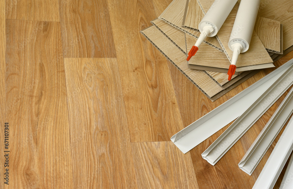 Set of items for PVC ceiling indoor works. Assembly adhesive bottles ...