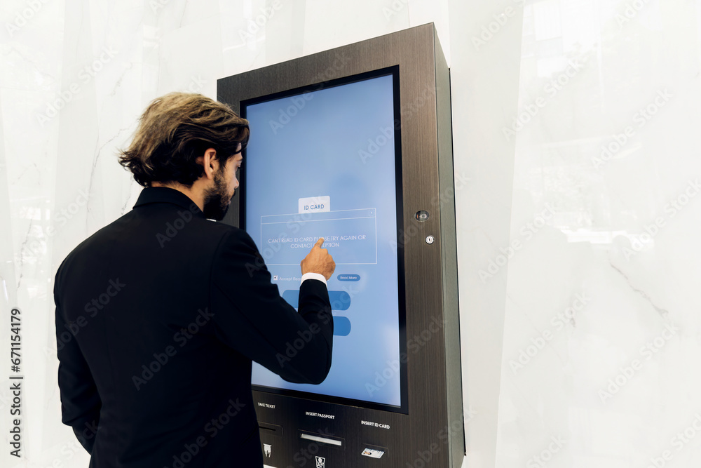 Businessman using card to open automatic gate machine in office ...