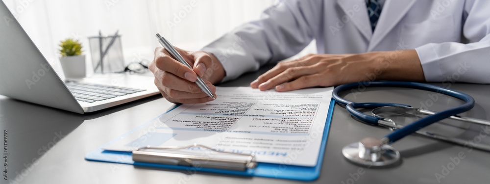 Doctor carefully review detailed medical report with laptop and ...