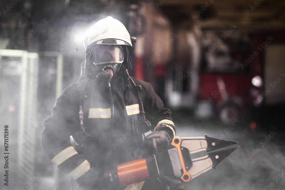 Fireman portrait wearing full equipment and oxygen mask. Firefighter ...