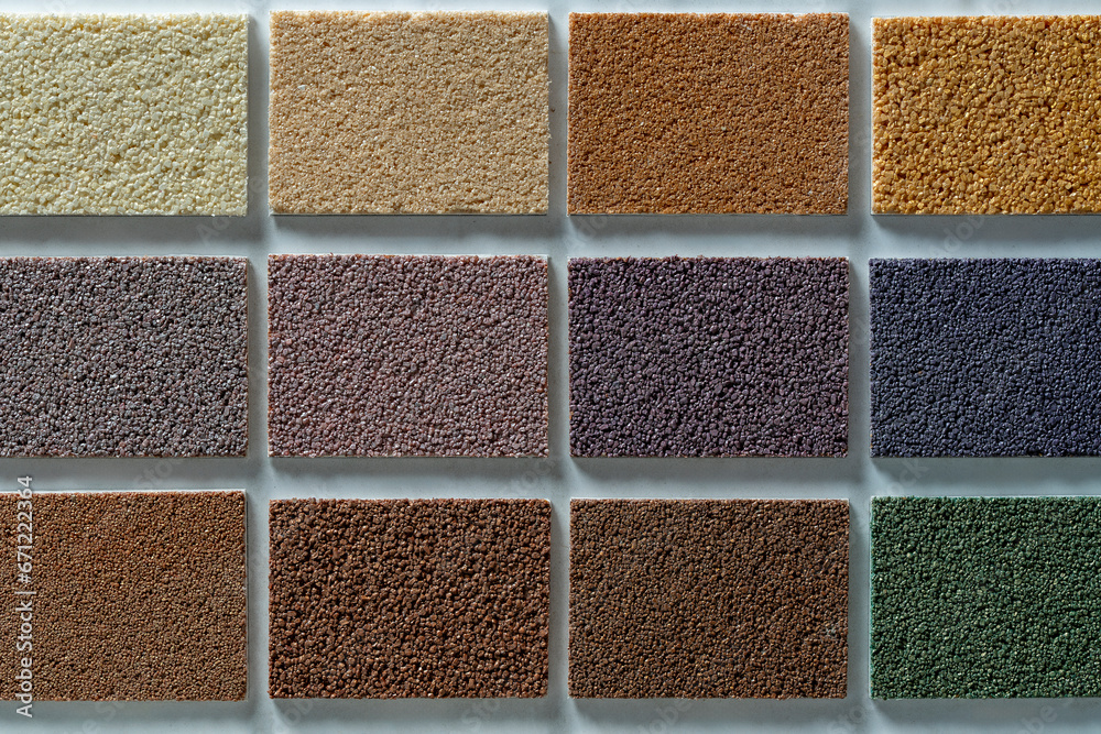 Samples of multi colored plaster for the decoration of the facade and ...