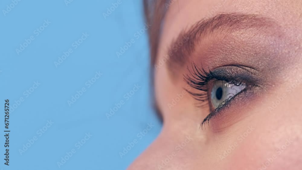 Female Human eye closeup. Side view. Girl's eye with brown color makeup ...