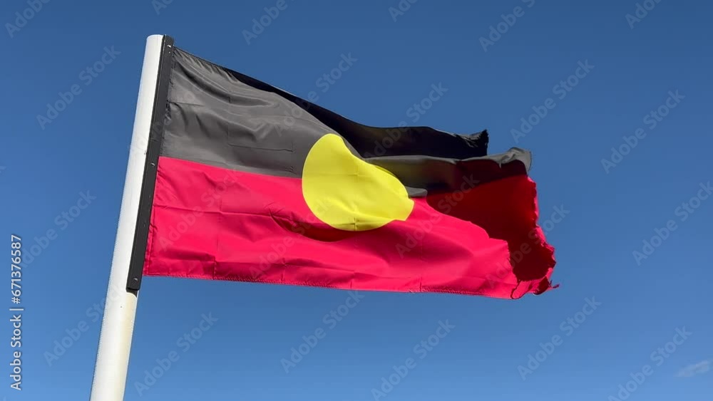 The Australian aboriginal flag of Australia first nation people waving ...
