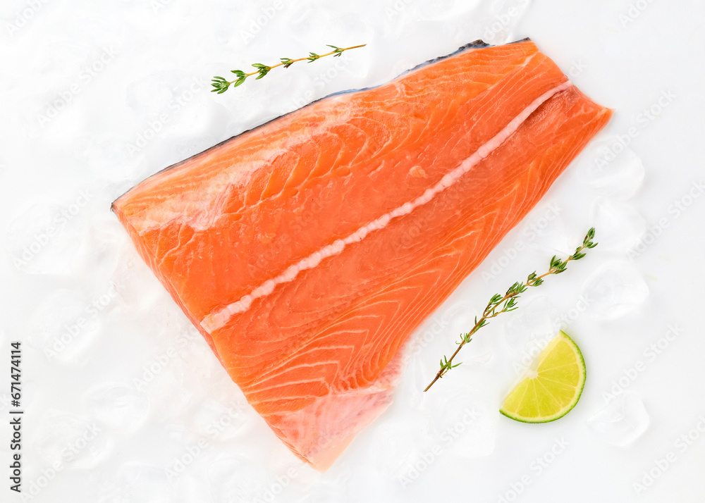 Salmon fillet sea fish peeled laid out on pieces of ice decorated with ...