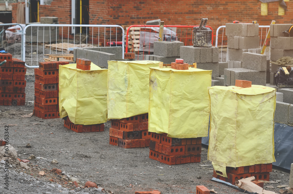 Red bricks and concrete blocks delivered on construction site and ...