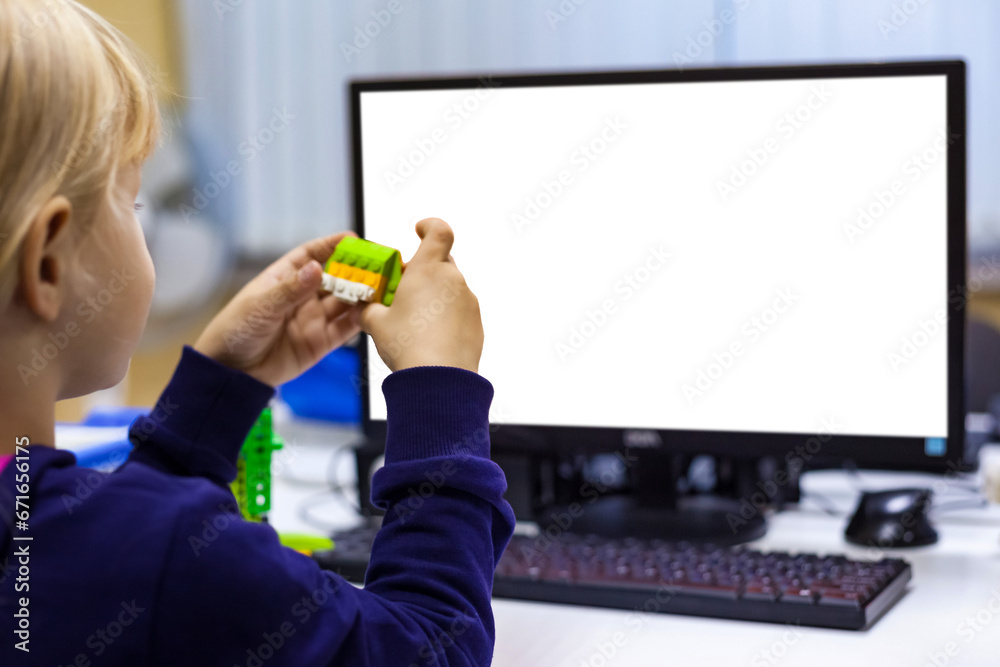 Kid girl 5 year old construct robotic toys, using constructor blocks ...