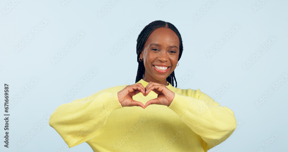 Portrait, heart and hands of black woman in studio for love, kindness ...