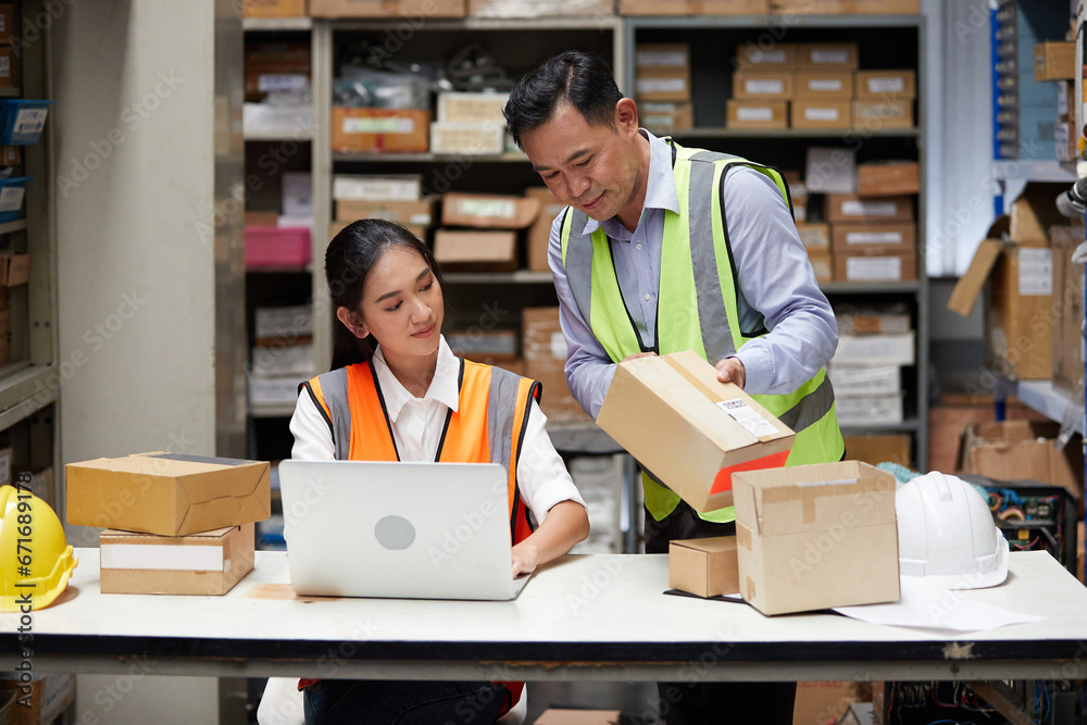 factory workers checking products from cardboard box packaging in the ...