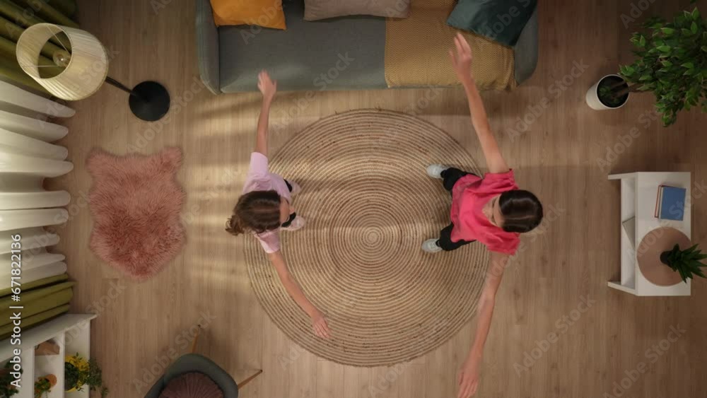 In the shot above, a woman and a child, they stand in a room in gym ...