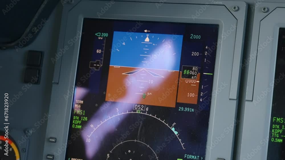 Boom up shot of pilot's primary flight display inside luxurious jet ...