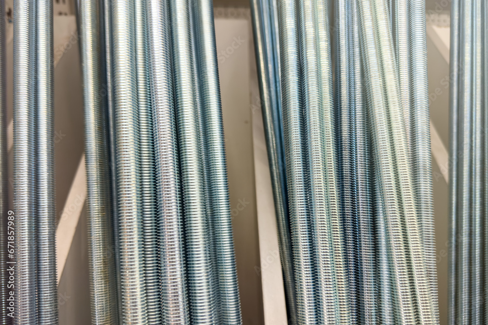Threaded rods or threaded studs. Galvanized metal rod with threads ...