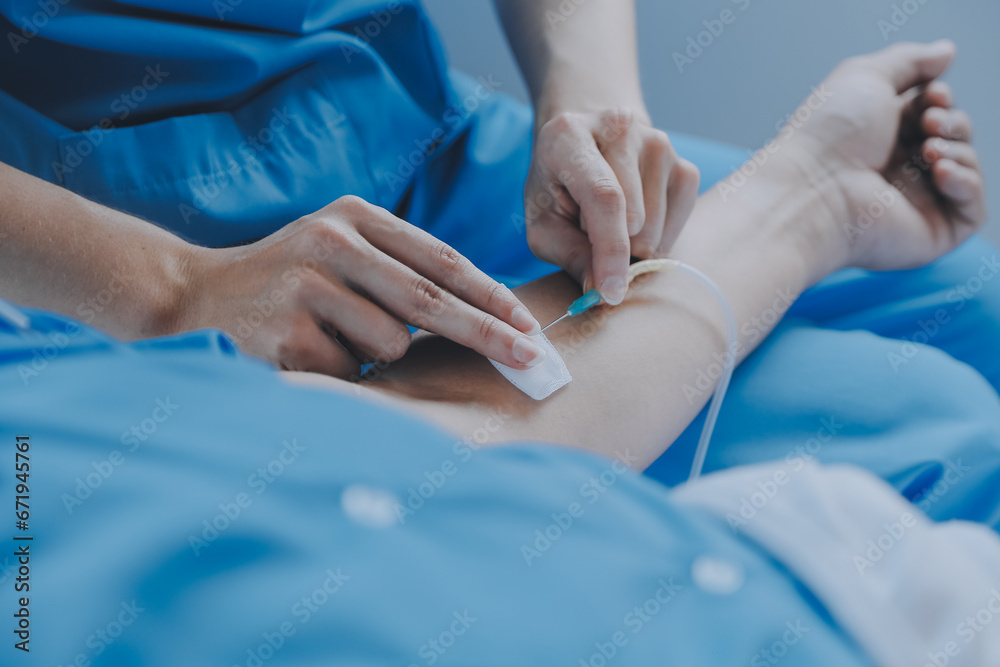Injured patient showing doctor broken wrist and arm with bandage in ...