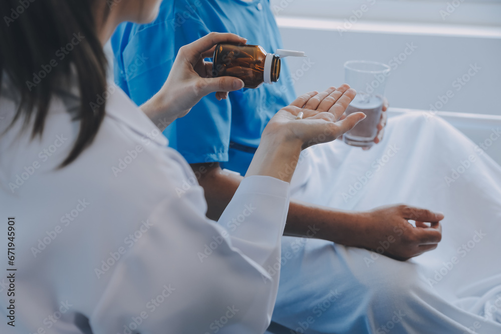 Injured patient showing doctor broken wrist and arm with bandage in ...