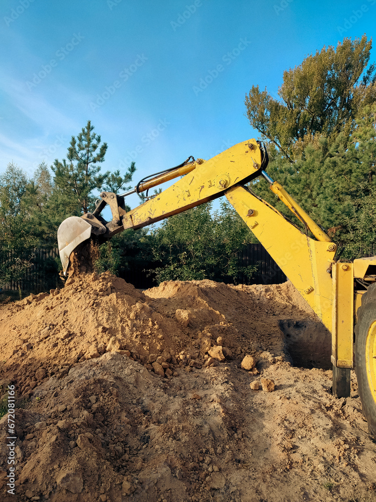 Digging the pit foundation a hole with excavator at the construction ...