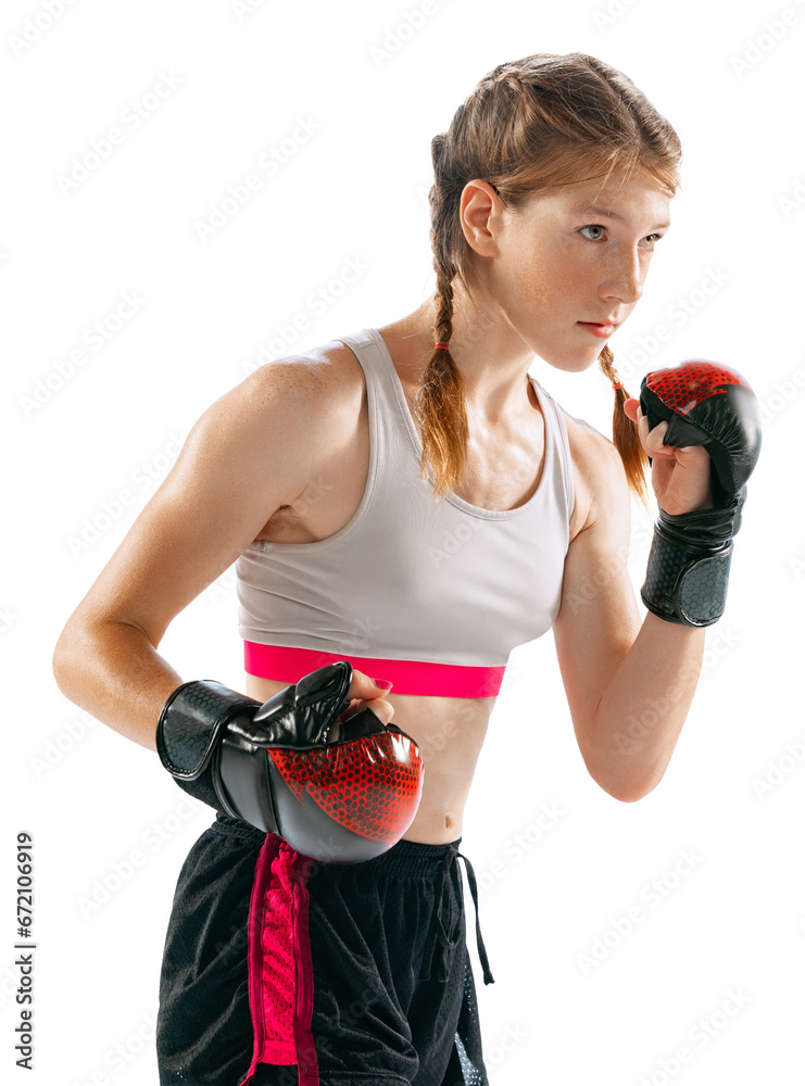 Sportive, concentrated teen-girl, professional MMA fighter in action ...