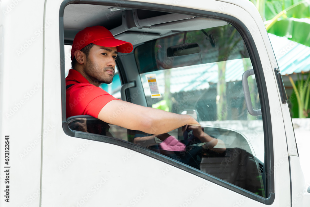 Happy Asian or Indian worker, delivery driver man, thumbs up to camera ...