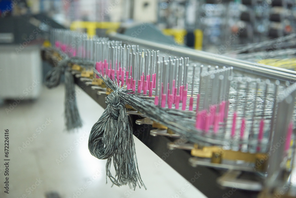 Cotton threads in industrial cotton in a weaving factory, machine ...