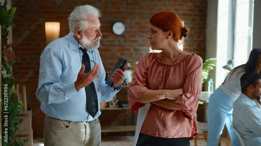 Elderly male employee supports upset depressed female co-worker ...