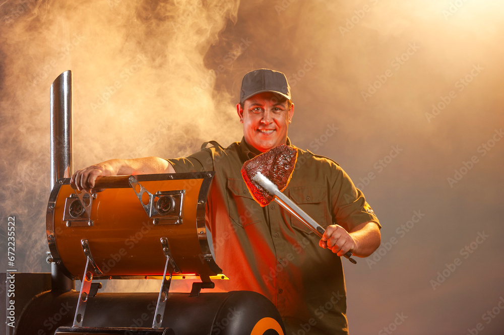 Foto de Barbecue master. Middle aged hispanic man for barbecue ...