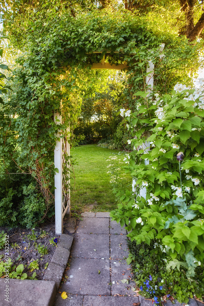 Big outside door in nature to beautiful garden. Decorative neglected ...