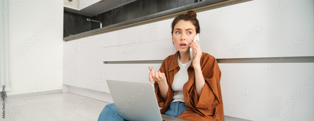 Woman with concerned, worried face, making a phone call, sitting on ...