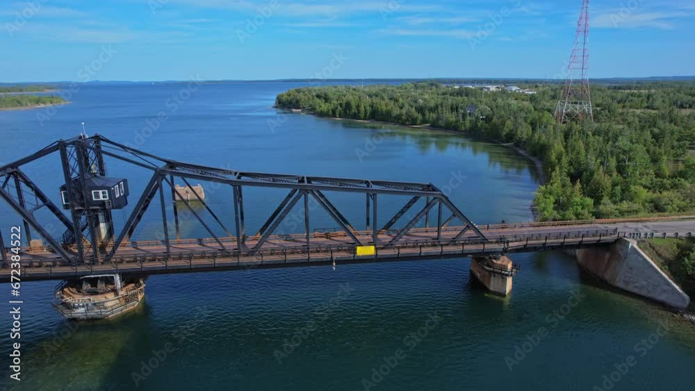 Little current swing bridge at sunny summer with blue sky. The bridge ...