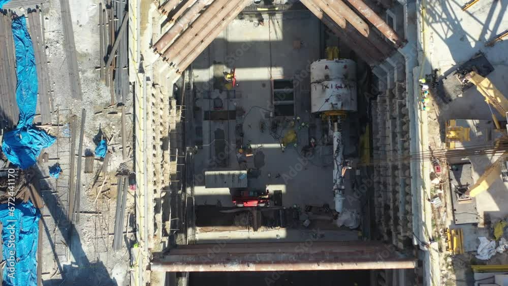 installation work of tunnel boring machine with crane at subway station ...