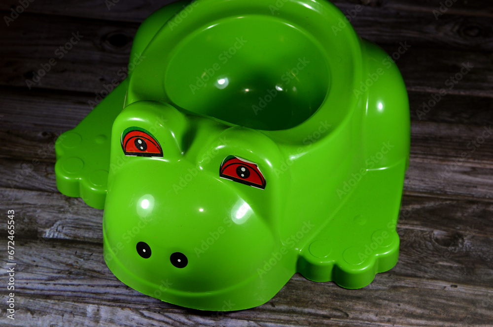 A potty chair, Potty, small chair or enclosure with an opening for ...