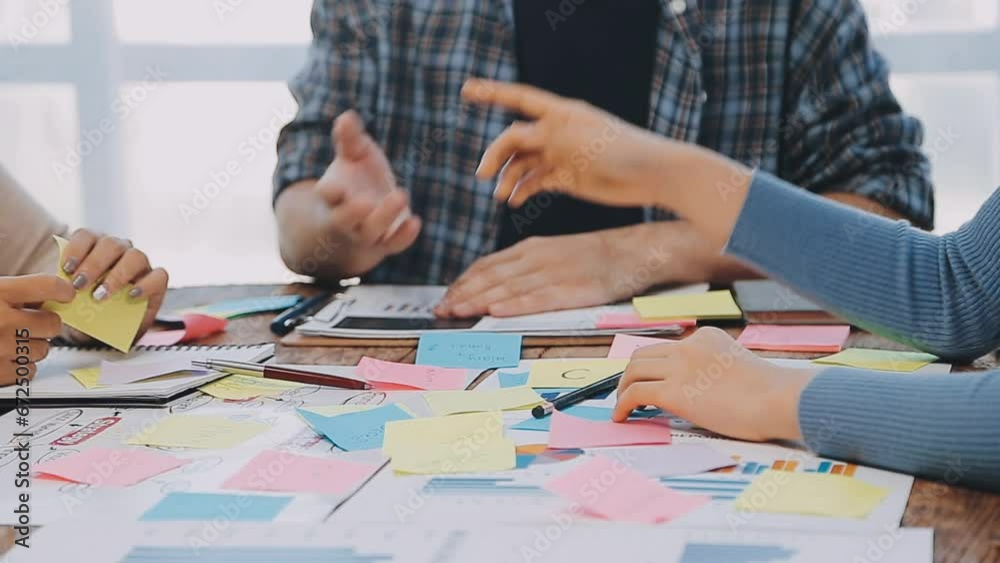 Two creative business people meeting and planning use post it notes ...