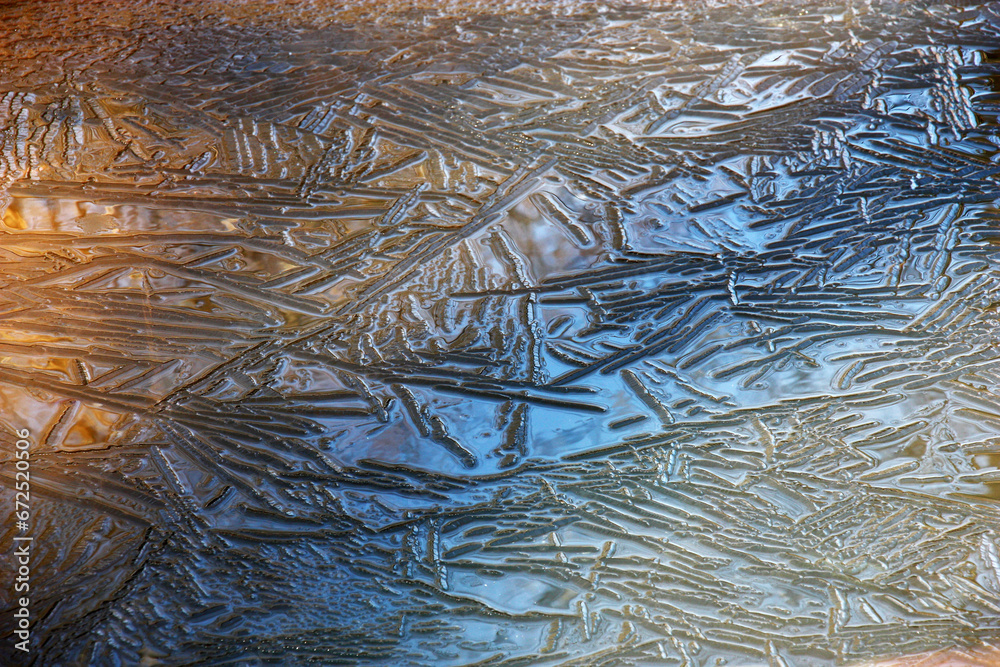 Winter sunny not frosty day. The abstract drawing on the surface of ice ...