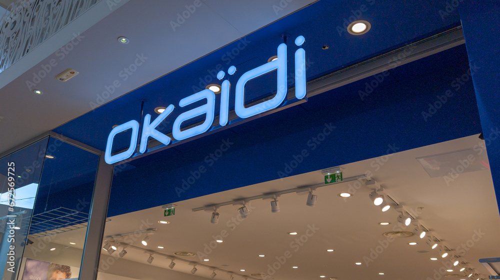 Okaidi sign logo shop and text brand front wall facade chain store ...